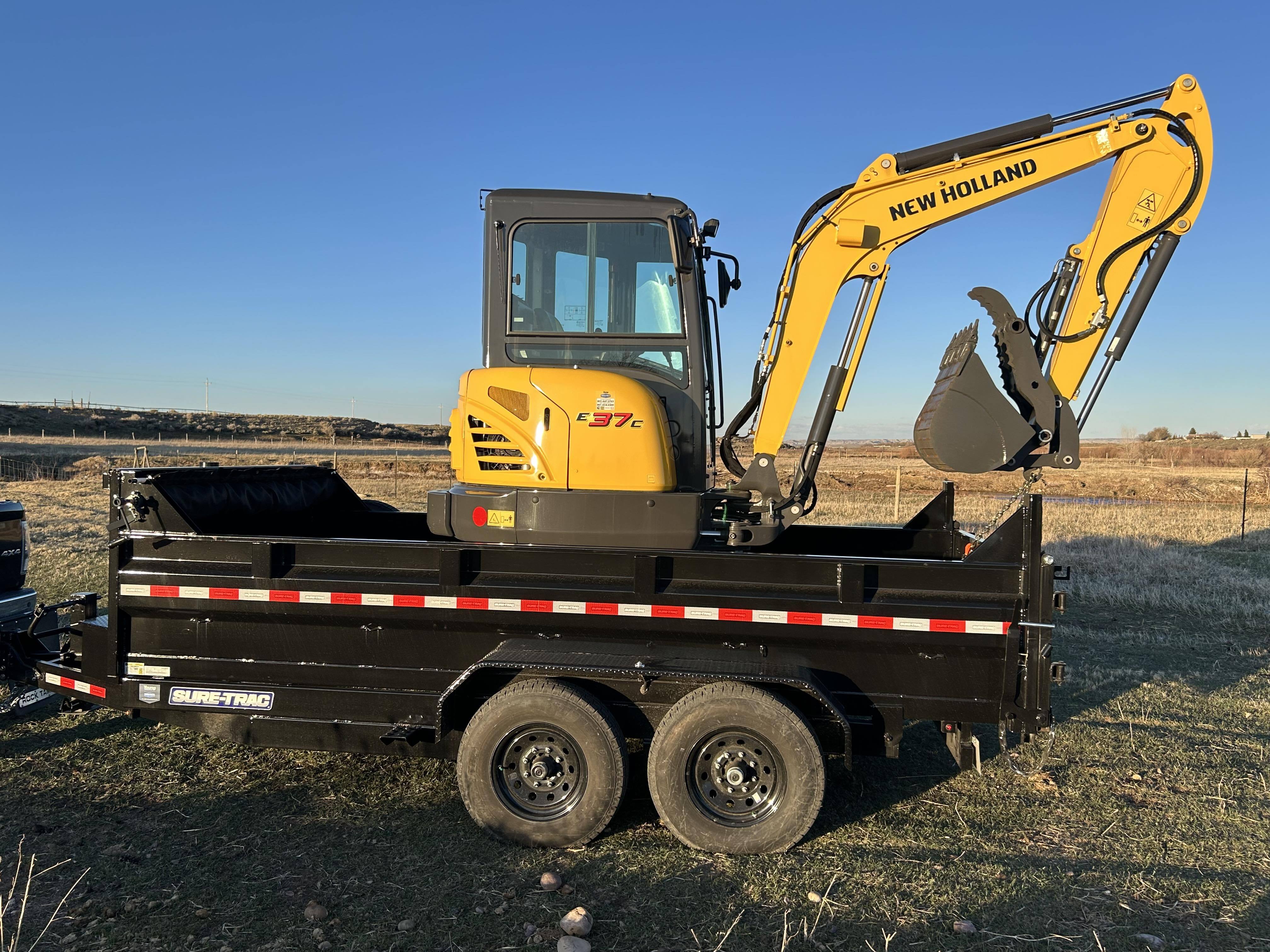 Excavator and Dump Trailer | Blacks Fork Equipment Rentals LLC